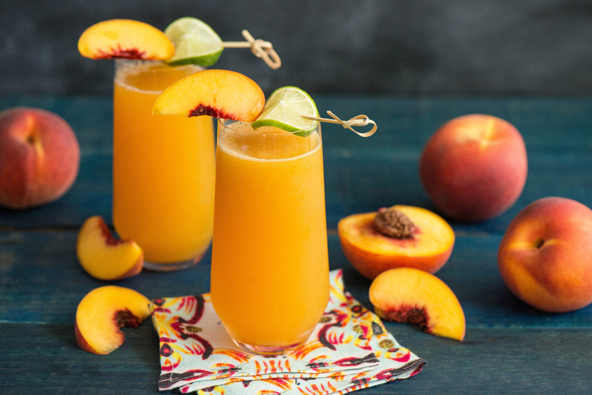Fizzy Peach Bellini Mocktail - Nibbles and Feasts